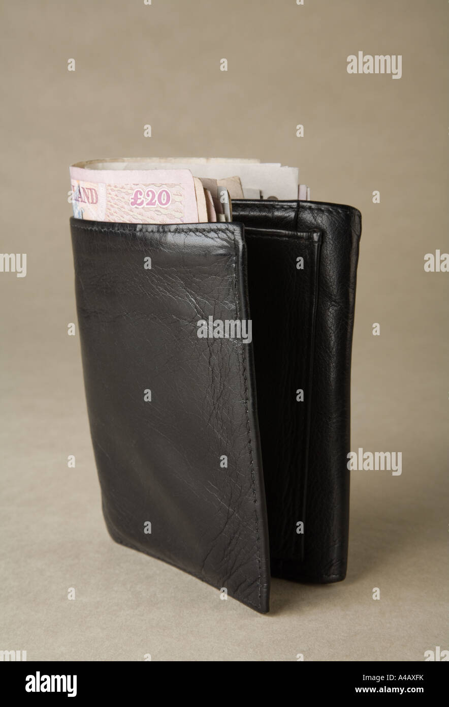 Money stuffed wallet hi-res stock photography and images - Alamy