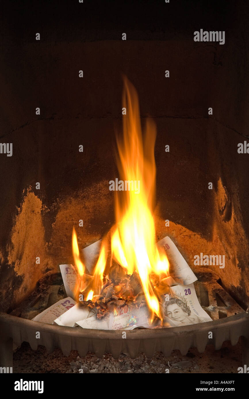 Money burning pounds notes hi-res stock photography and images - Alamy