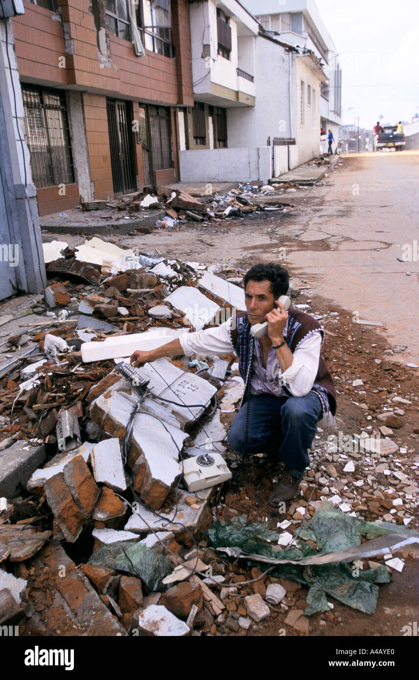 Earthquake in Colombia 1999 - A man tries to get a phone line on a ...