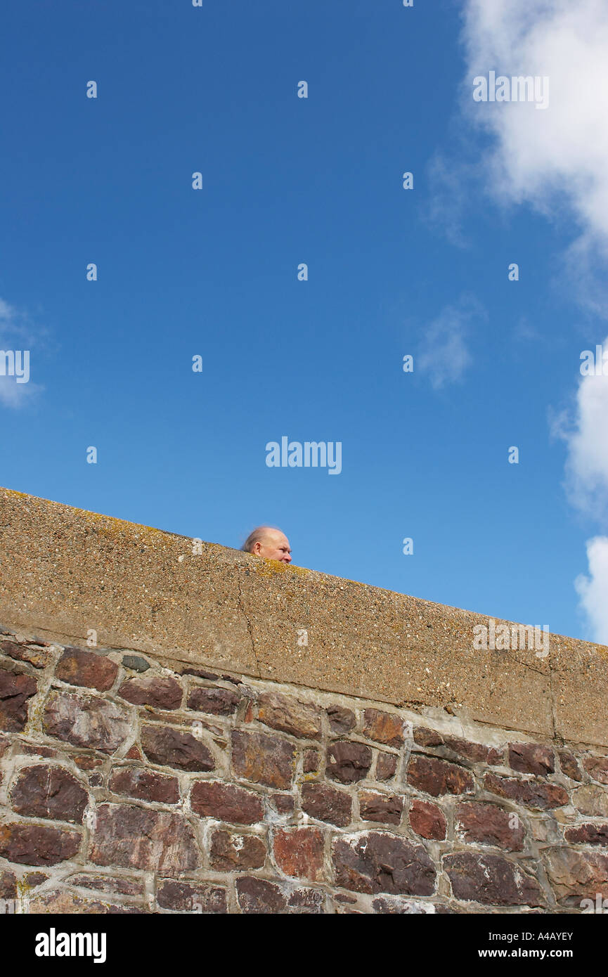 Looking over a wall hi-res stock photography and images - Alamy