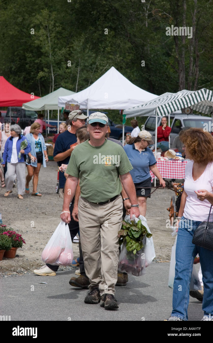 Man carrying produce purchased at the Farmers Market Stock Photo - Alamy
