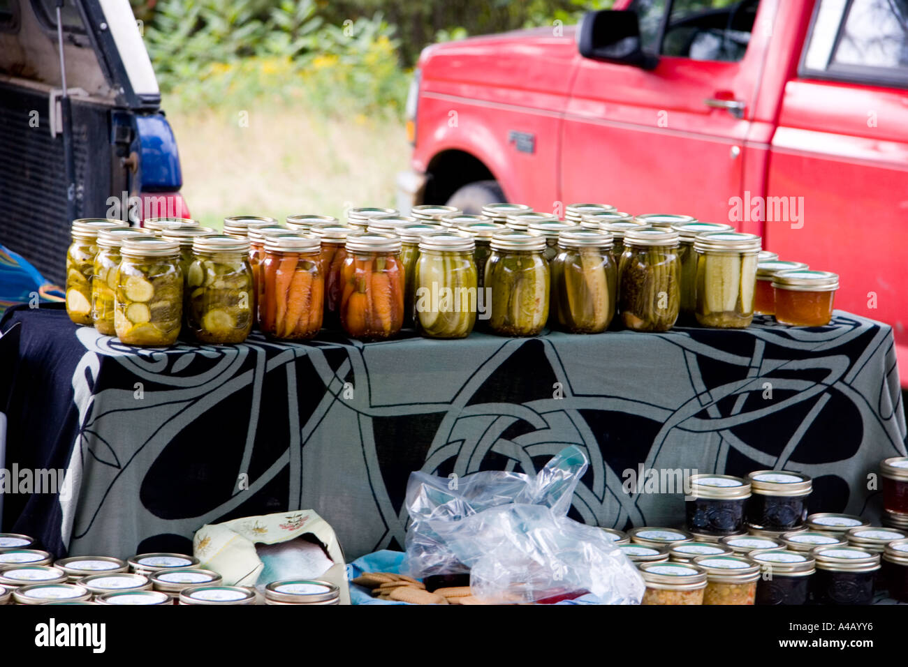 Canned goods being sold at the local farmer's market Stock Photo - Alamy