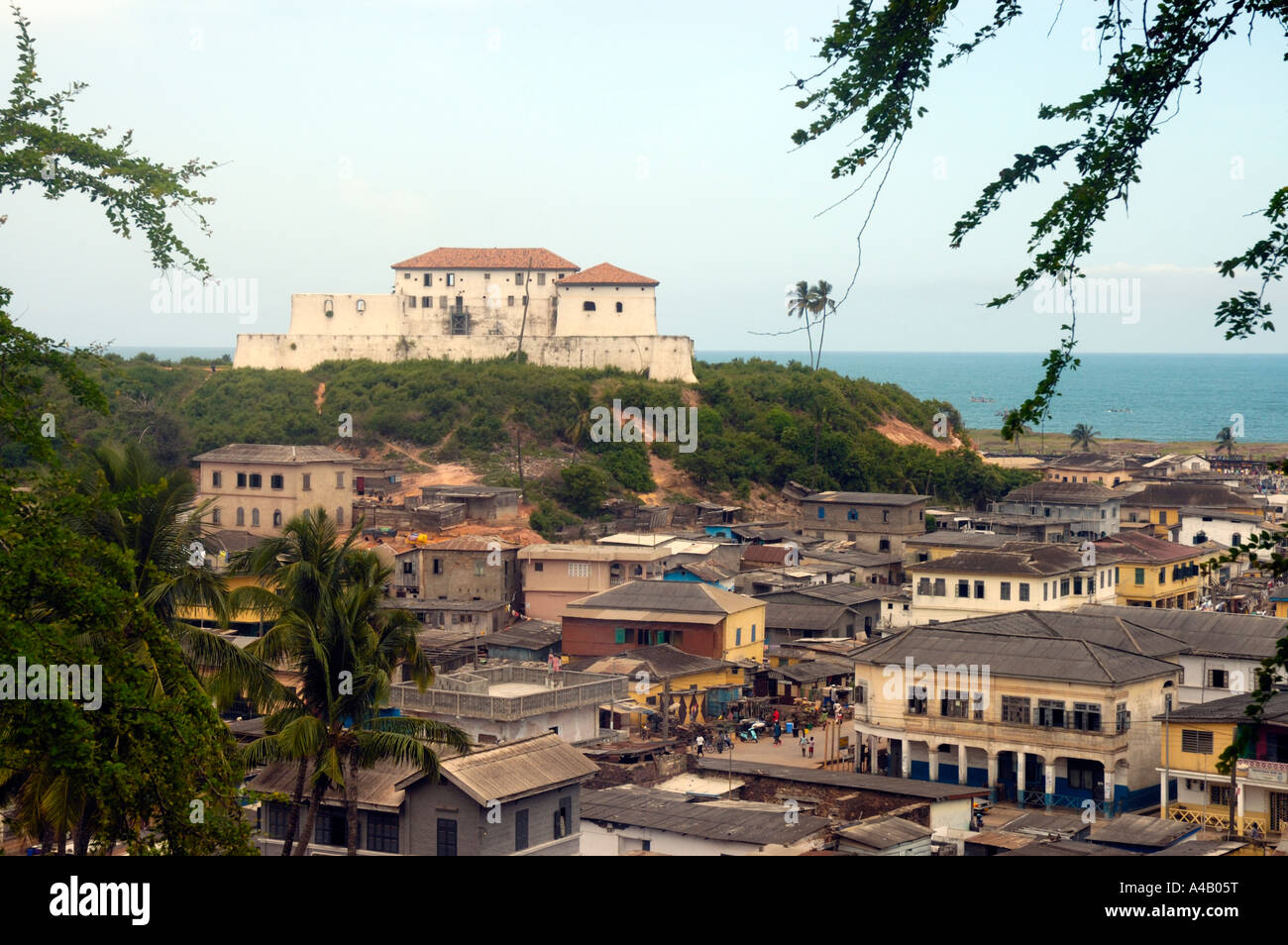 View of a fortress in Elmina and parts of the town towards the sea in ...