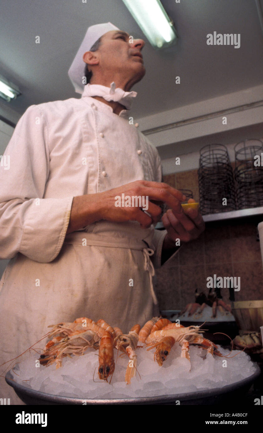 Chef getting ready to cook for restaurant Sete France Stock Photo - Alamy