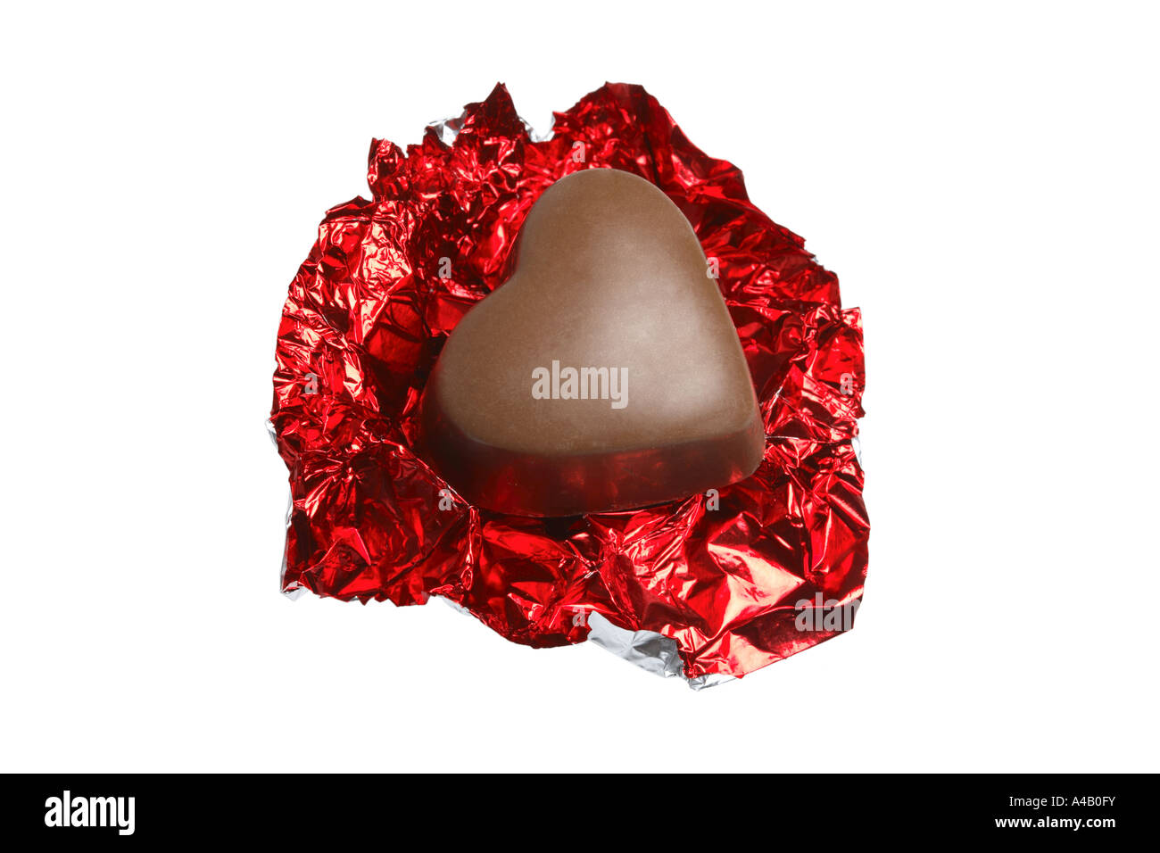 Chocolate Heart with Wrapper cut out on white background Stock Photo ...