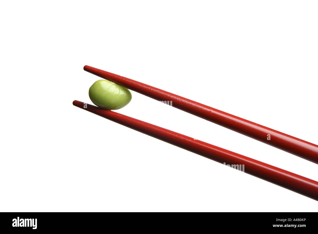 Chopsticks with Soy Bean cut out on white background Stock Photo - Alamy