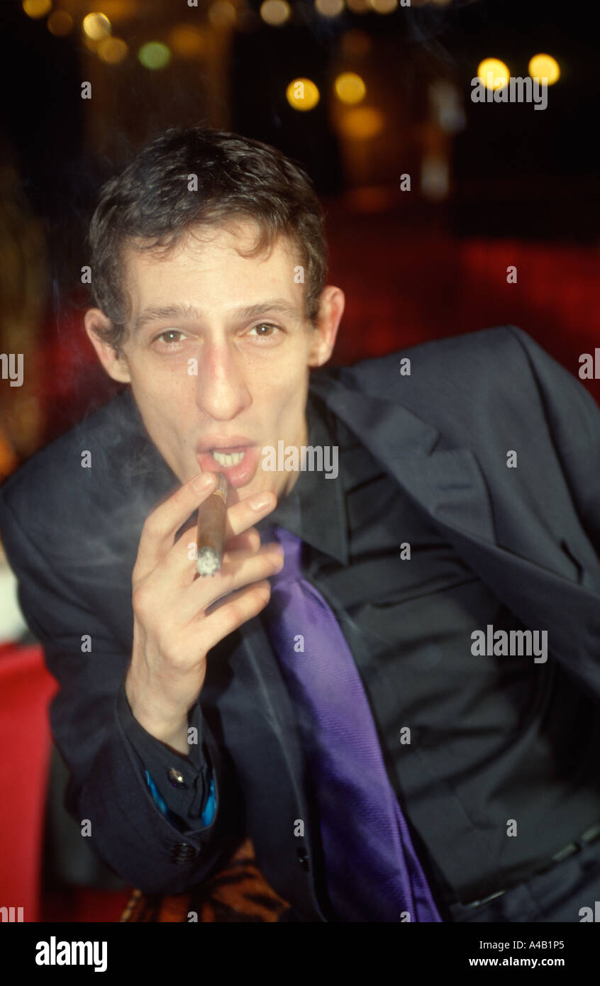 Actor Martin Hancock smoking a large cigar in The Reform restaurant in ...
