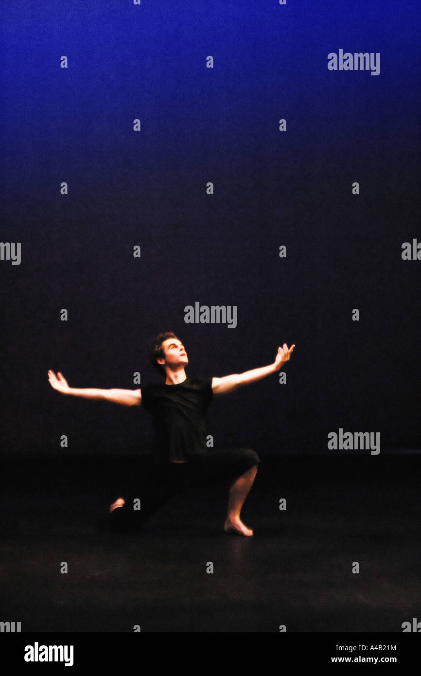 man on stage with arms open Stock Photo - Alamy