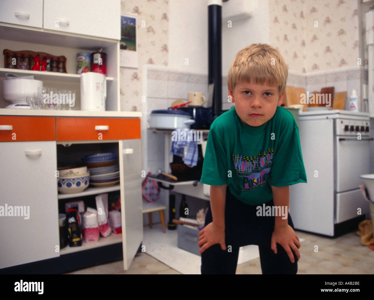 Boy in kitchen Stock Photo - Alamy