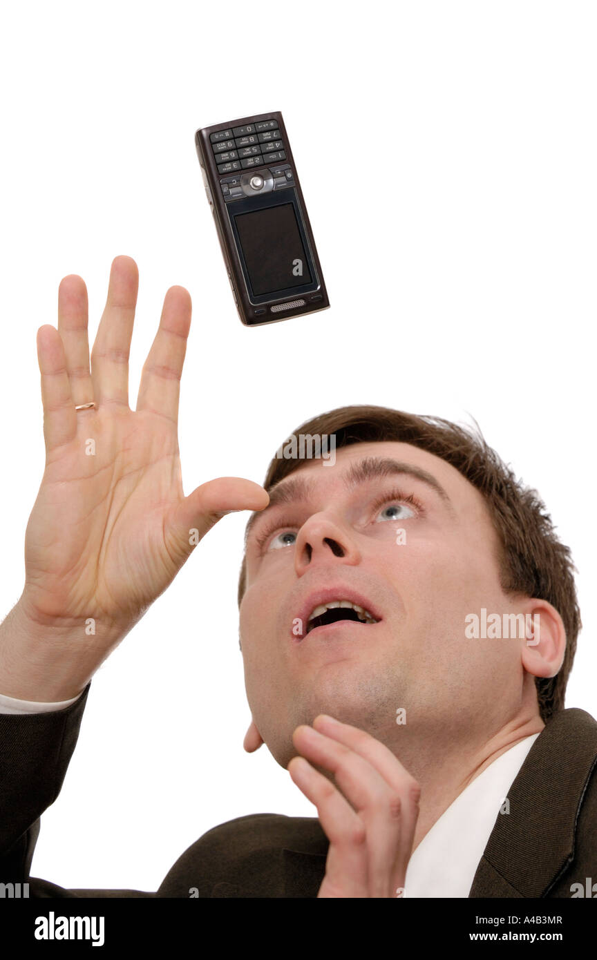 Catching a call Young businessman trying to catch a cell phone Stock ...