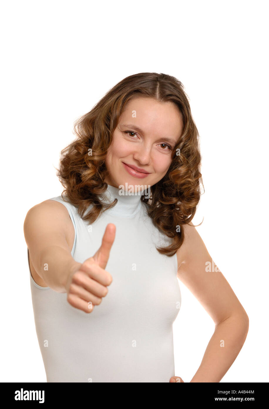 Young smiling woman showing a thumb up gesture Stock Photo - Alamy