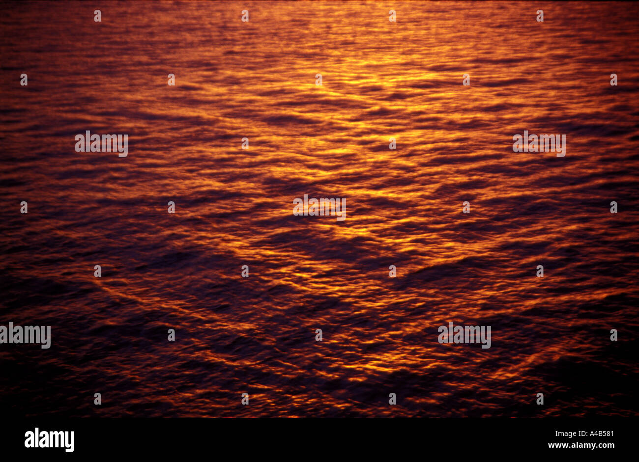 sunset over water Stock Photo - Alamy