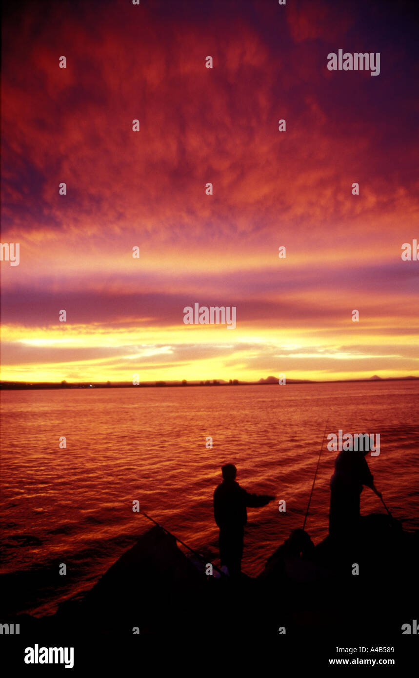 sunset over water Stock Photo - Alamy