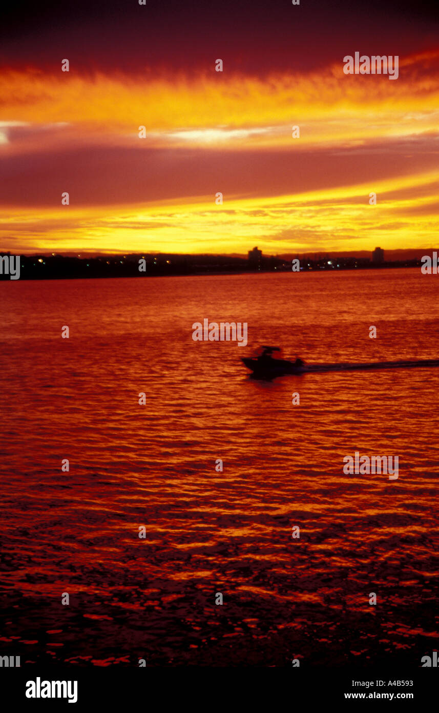 sunset over water Stock Photo - Alamy