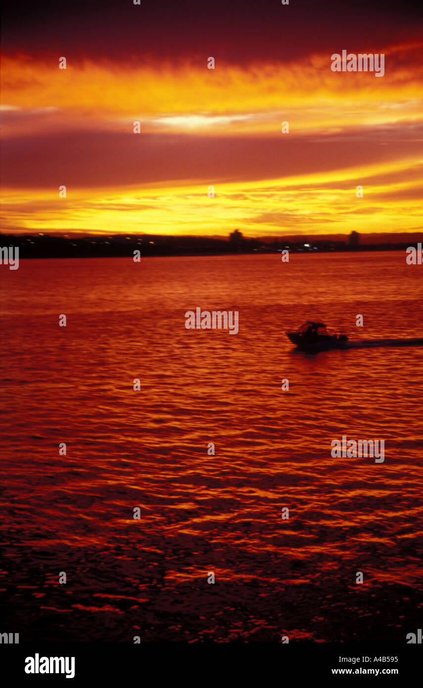 sunset over water Stock Photo - Alamy