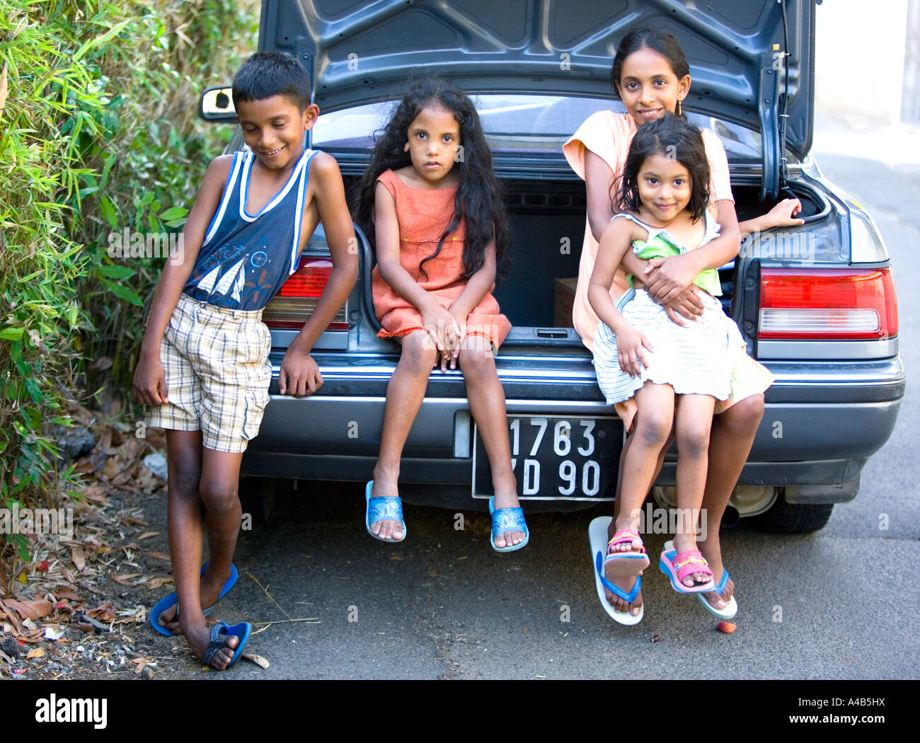 Some posing sitting in open car boot trunk hi-res stock photography and ...