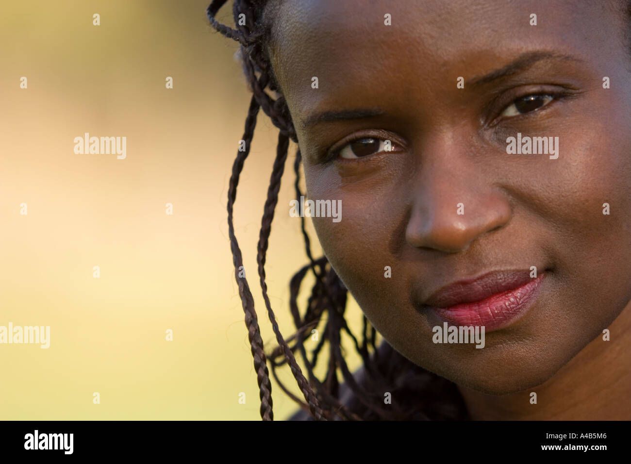 A beautiful black woman shot in close up with a wistful smile Stock ...