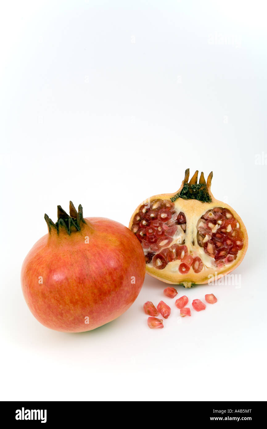 Split open pomegranate fruit Cut Out Stock Images & Pictures - Alamy