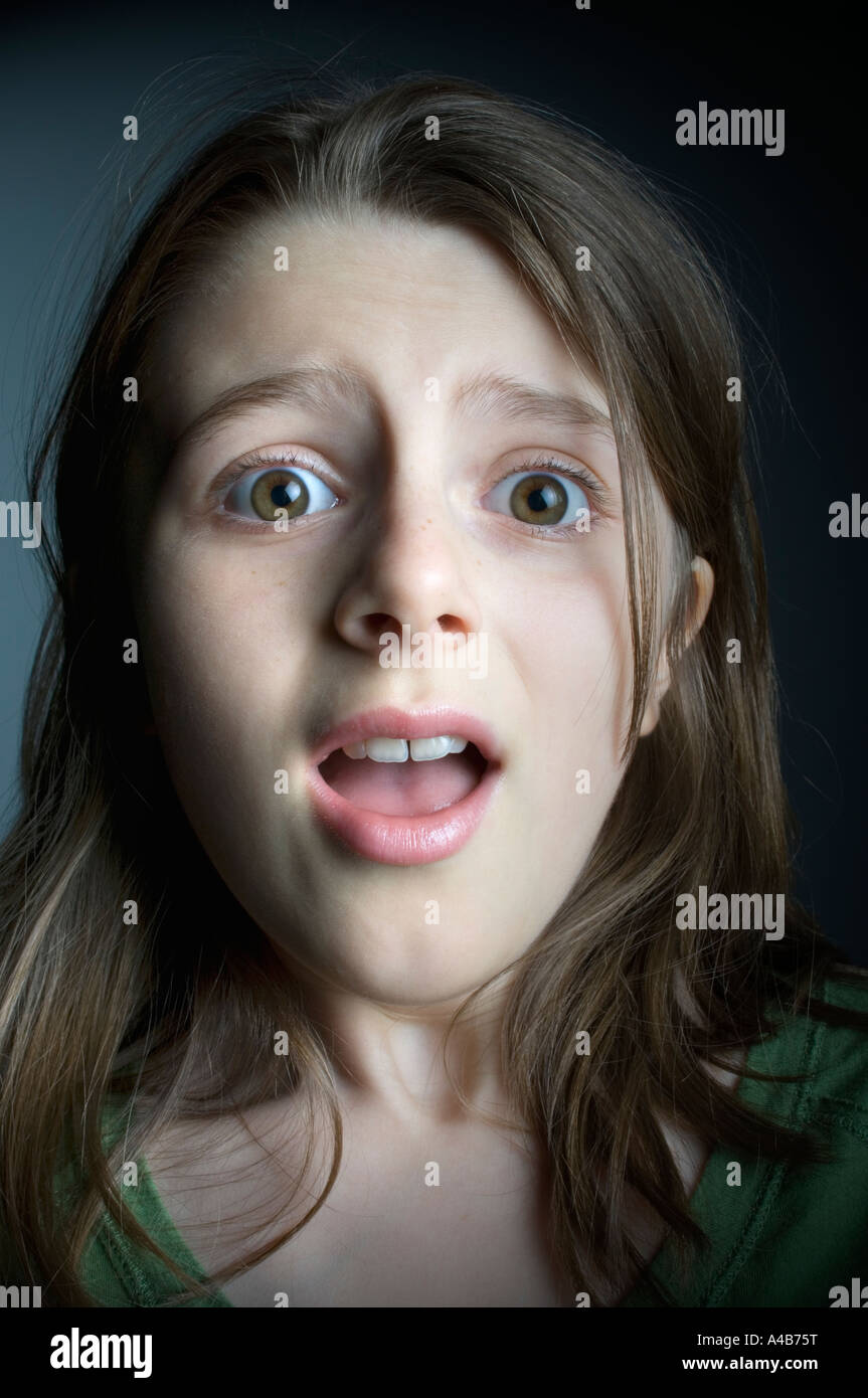 Portrait of young girl looking scared Stock Photo - Alamy Portrait of young girl looking scared Stock Photo - Alamy