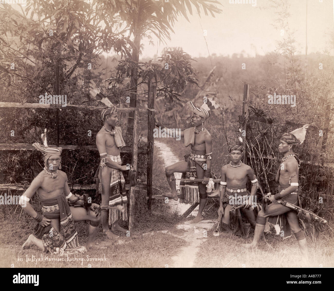Group of Land Dyaks with weapons Sarawak Stock Photo - Alamy