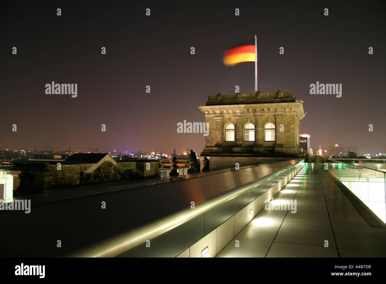 flag flying above reichstag tower at night berlin germany Stock Photo ...