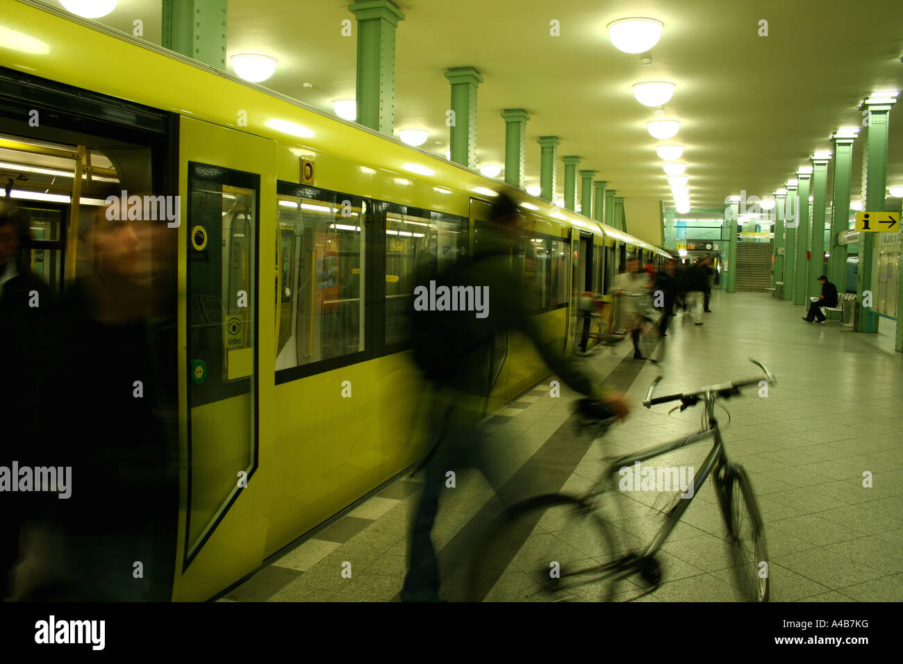 passengers alighting train in underground station Stock Photo - Alamy