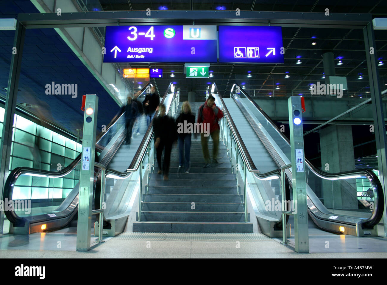 people descending escalators and stairs Stock Photo - Alamy