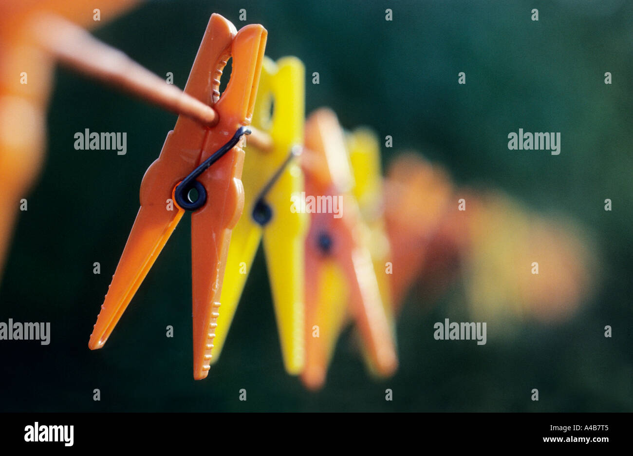 Plastic clothes pegs on washing line Wales UK Stock Photo - Alamy