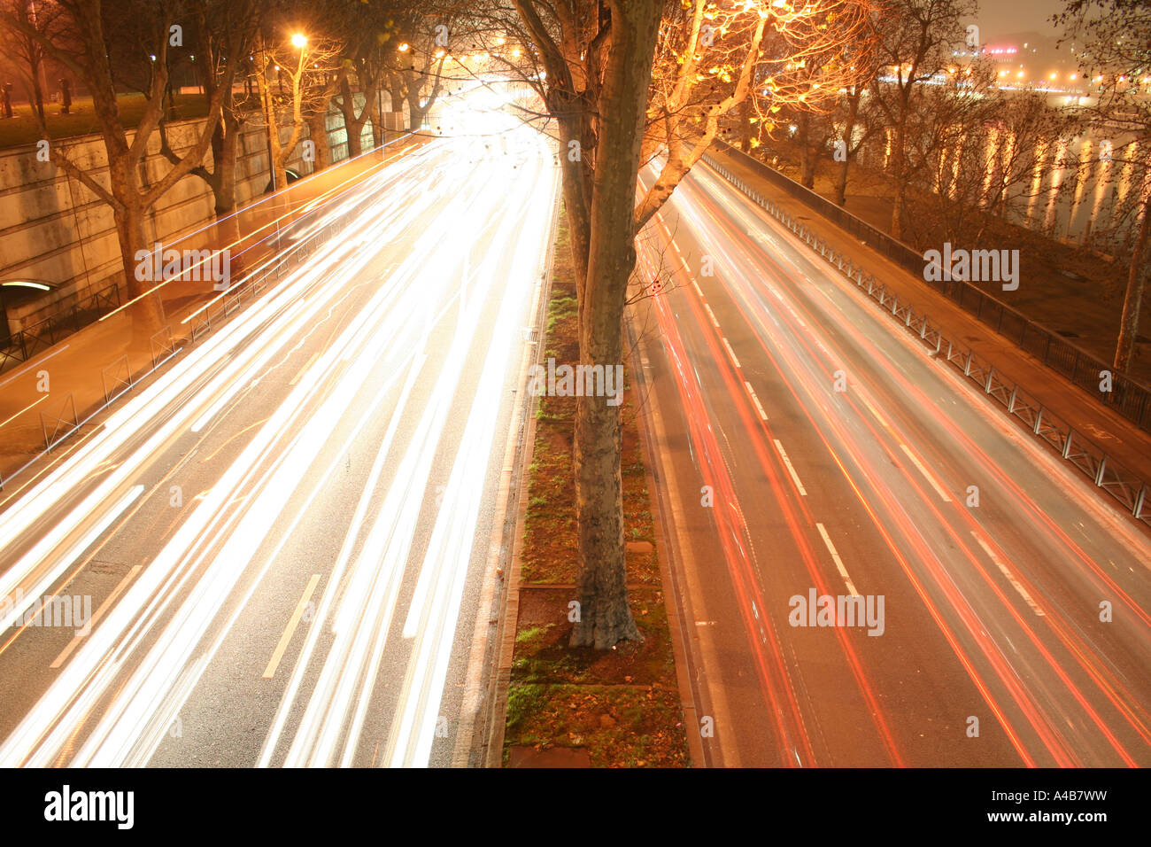 busy road at night illuminated bu car lights Stock Photo - Alamy