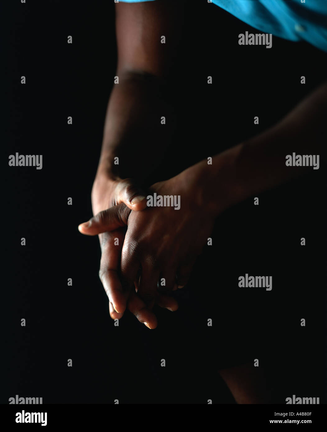 Two hands touching in a reflective pose Stock Photo - Alamy