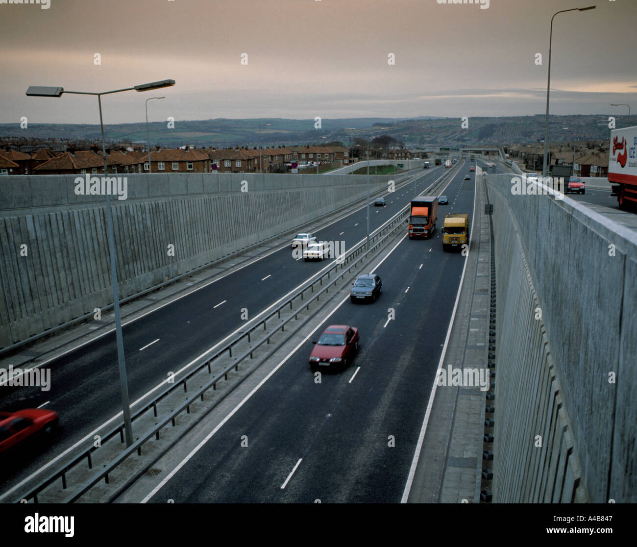 Trunk road intersection showing slip roads, concrete retaining walls ...