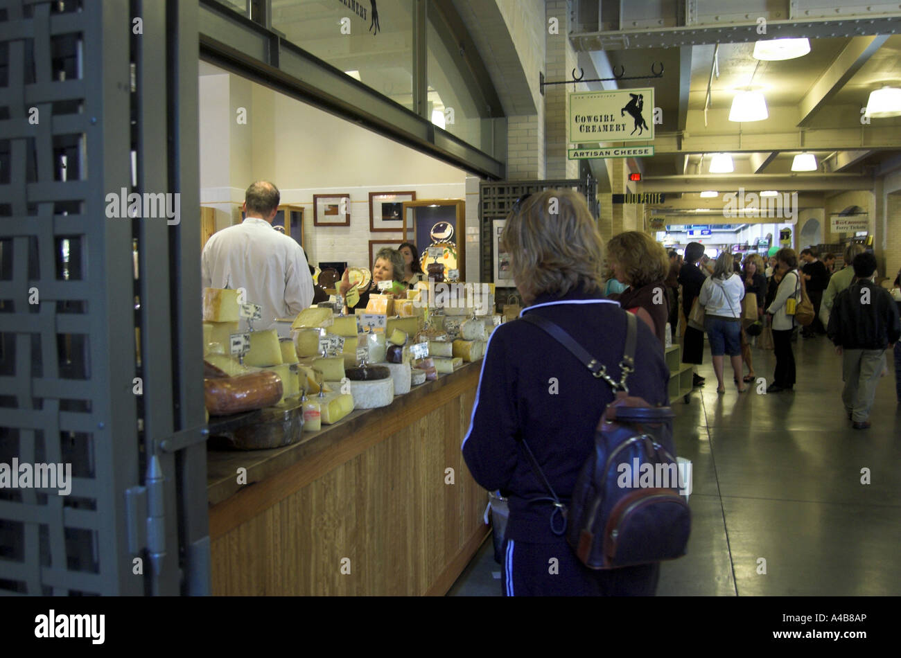Shopping at a gourmet cheese specialty shop inside the Ferry Building ...