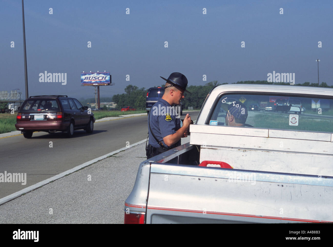 Traffic cop talking driver hi-res stock photography and images - Alamy