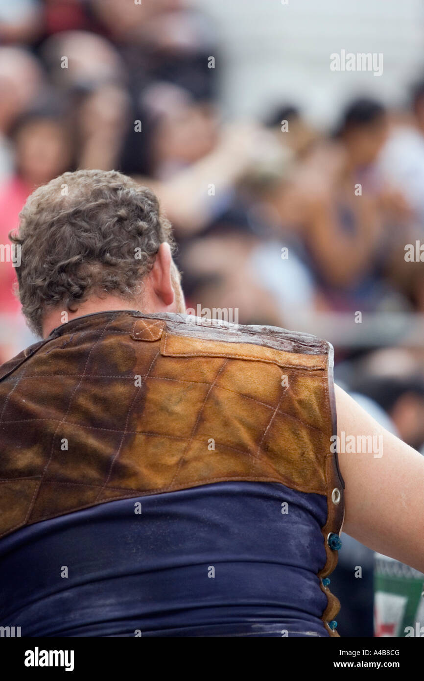 Seated male harrijasotzaileak (stone lifting) competitor, Basque ...