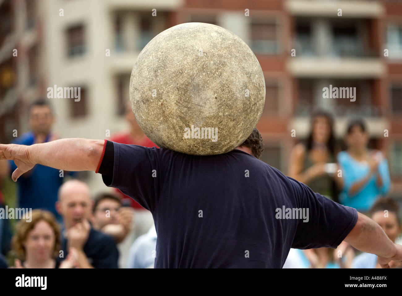 Harrijasotzaileak (stone lifting) competitor carrying granite ball on ...