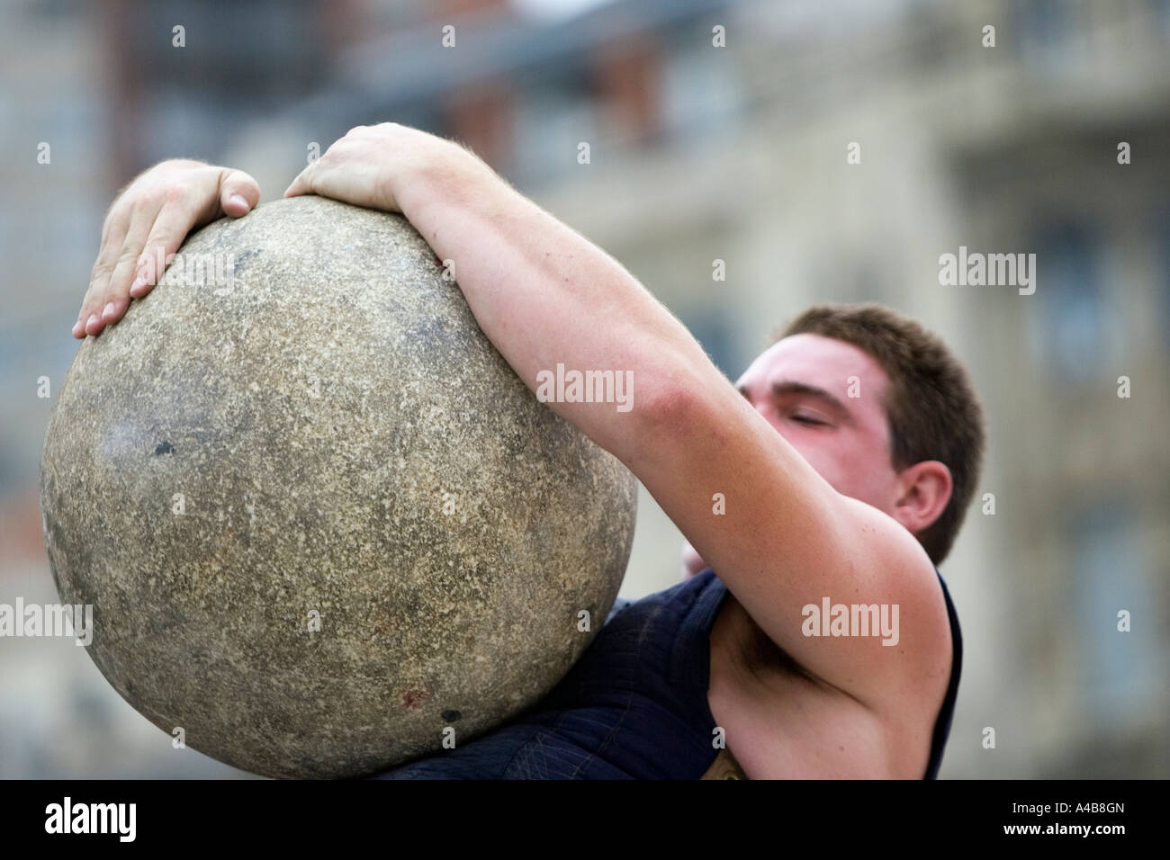 Harrijasotzaileak (stone lifting) competitor grasping granite ball to ...