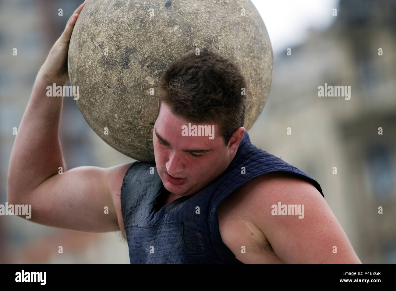 Harrijasotzaileak (stone lifting) competitor holding granite ball on ...