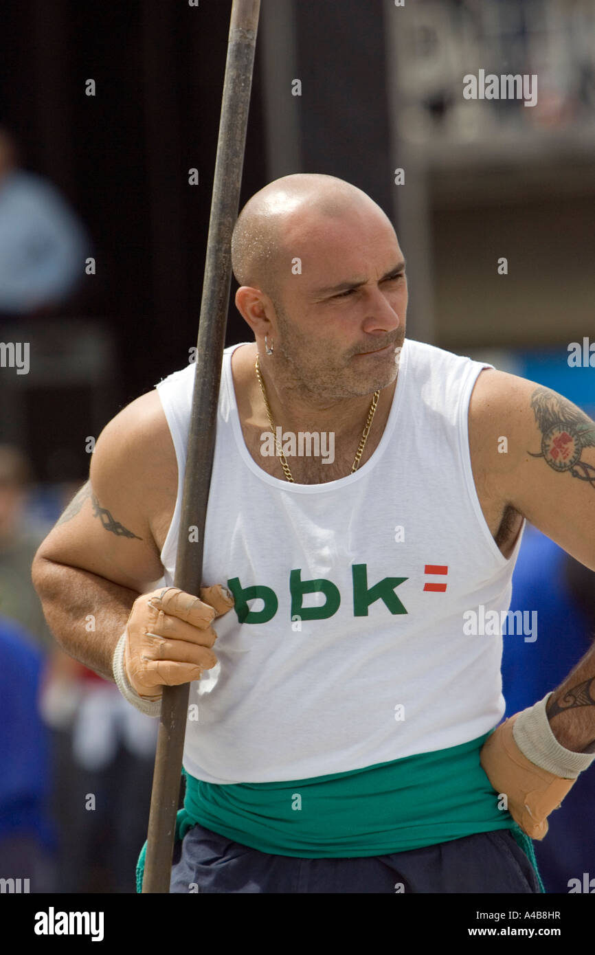 Barrenador (stone drilling) competitor resting, Basque Strongman Games ...
