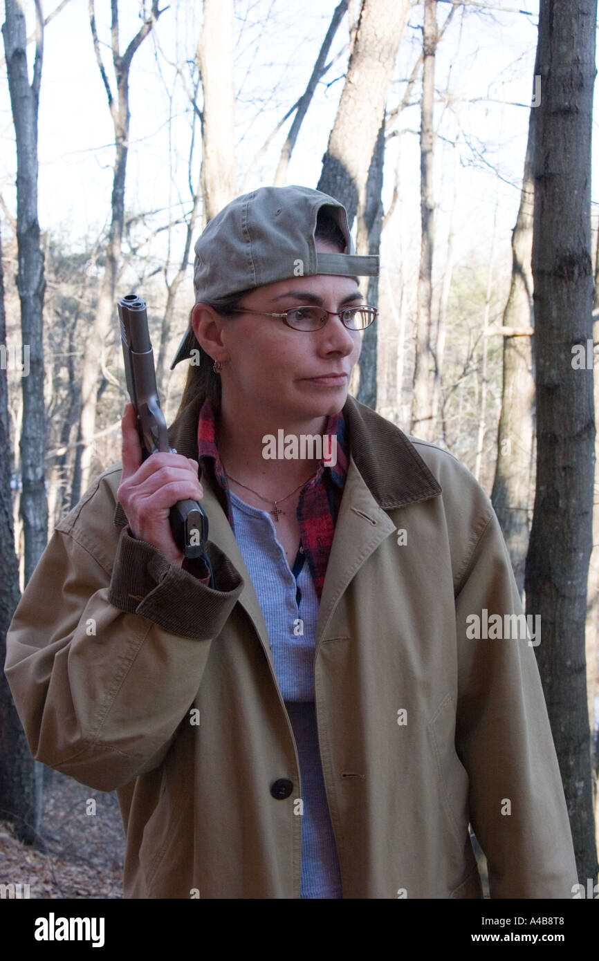 Woman at target practice, holding her semi-automatic, .45 ACP, handgun ...