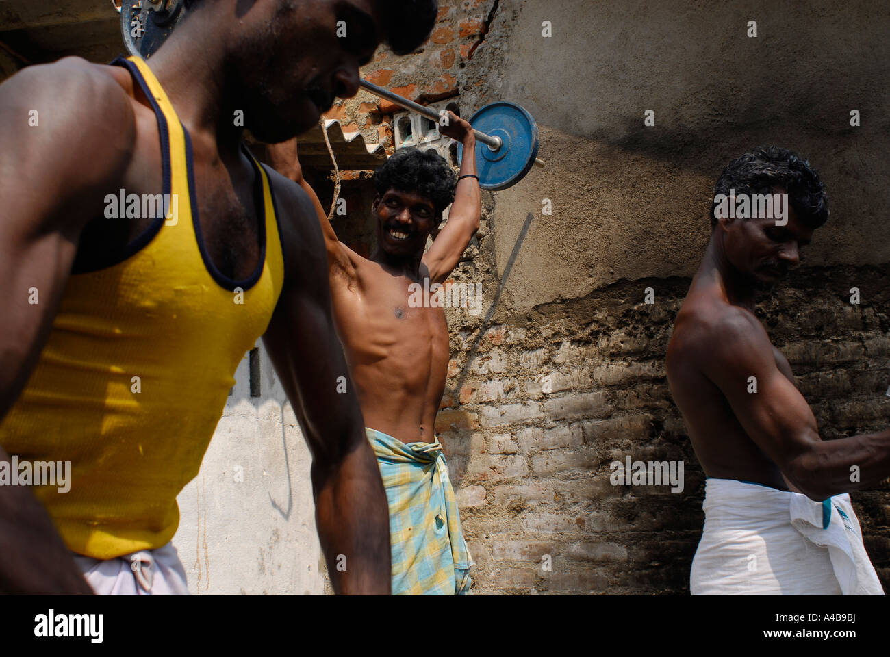Stock image of Indian tribal village Dalit men weight training at very ...