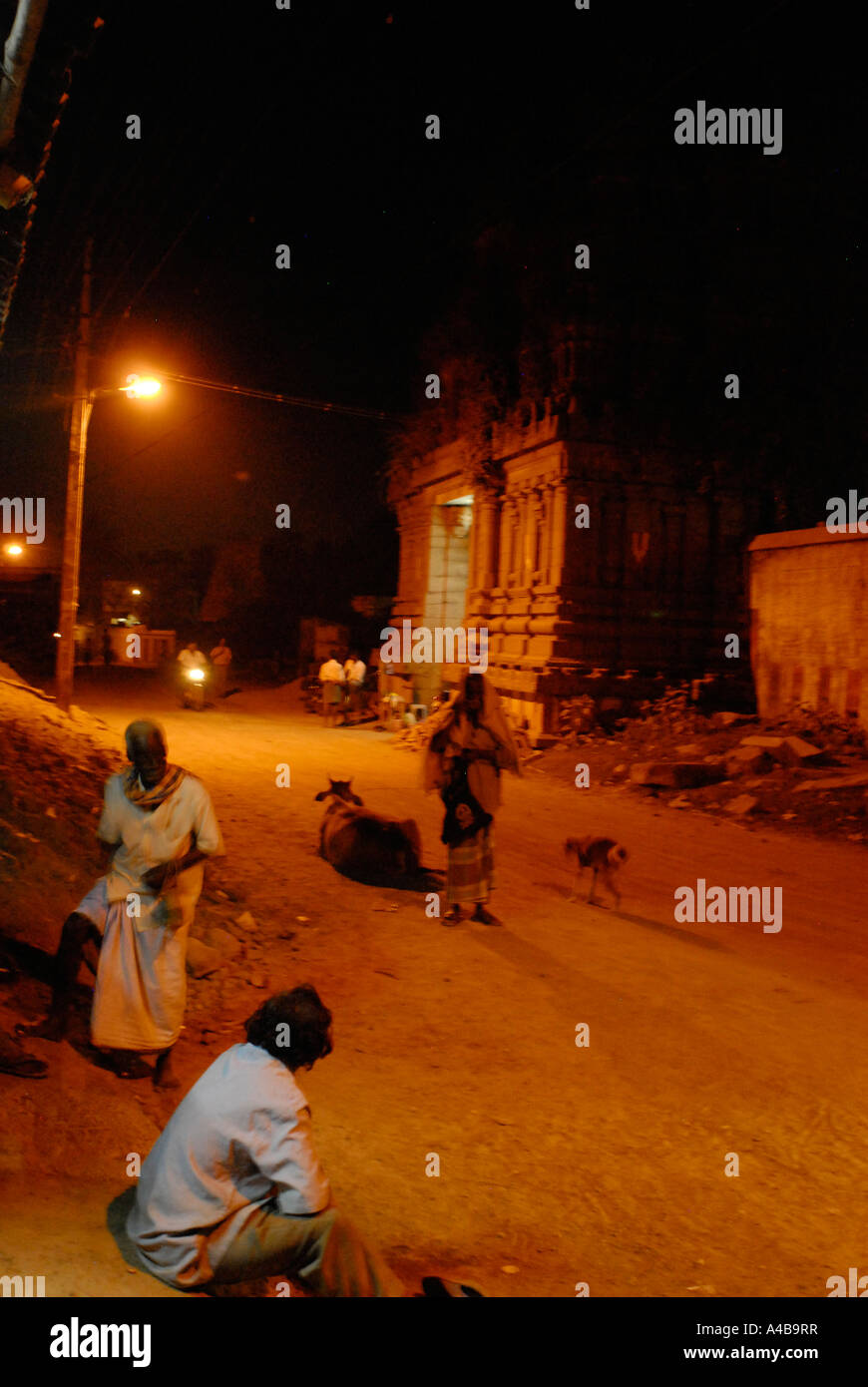 Stock image of nearly empty tribal village street at night at first ...