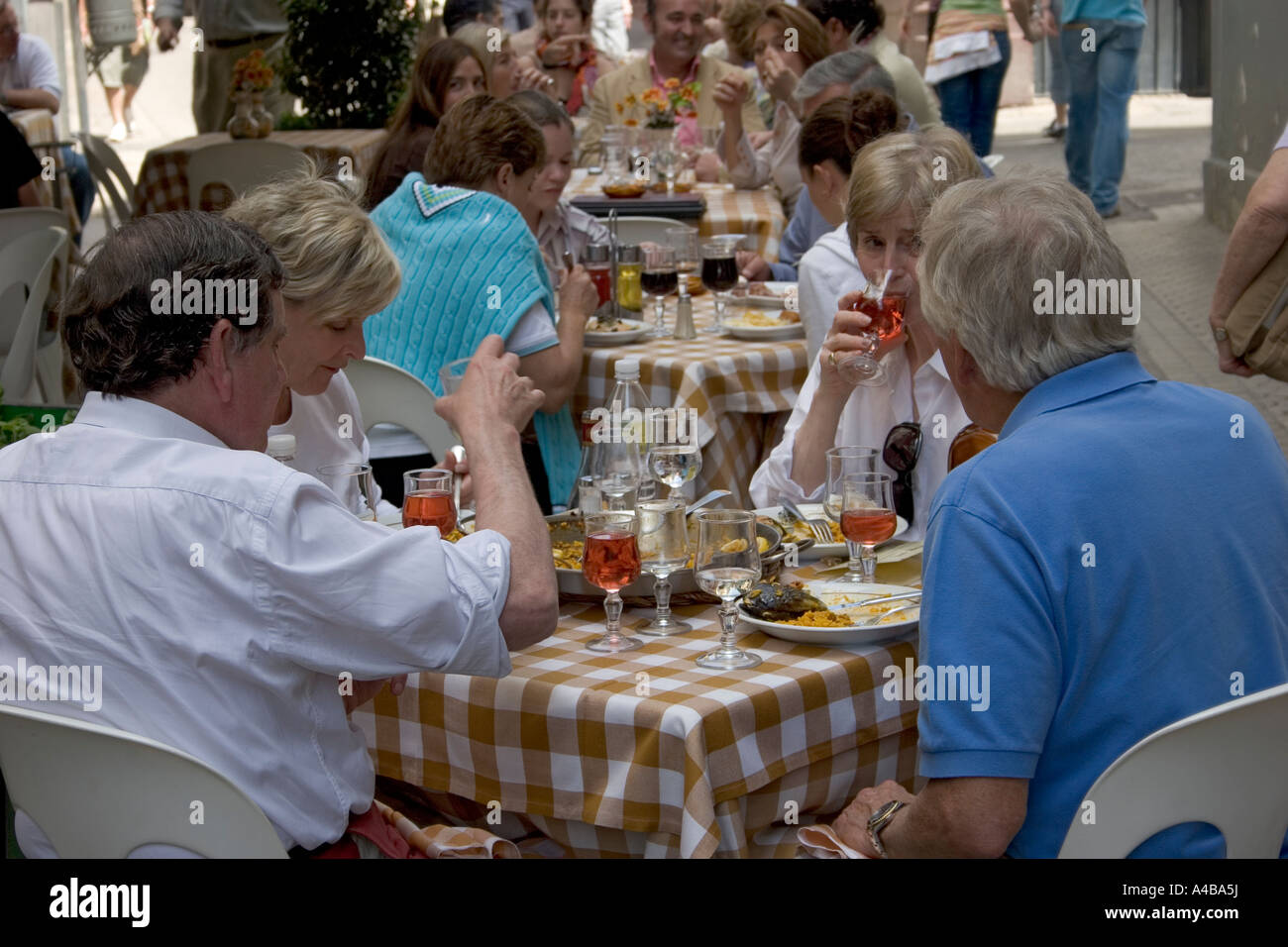 People eating traditional Spanish food in the streets of Seville Stock ...
