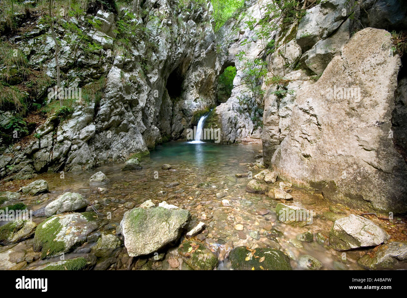 spectacular waterfall from a hole in the rocks Stock Photo - Alamy