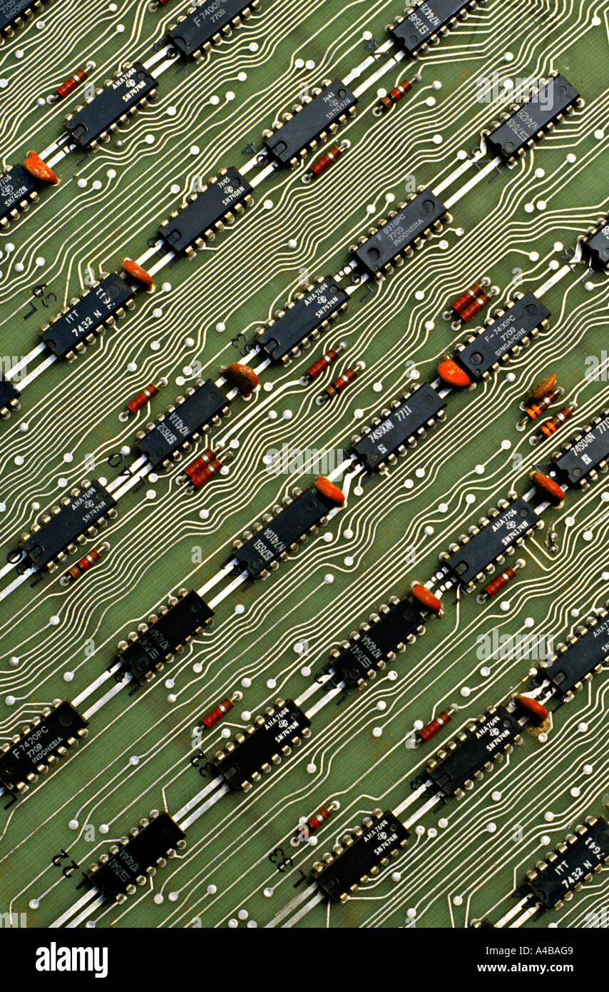 Rows of microprocessor chips on computer circuit board with electrical ...