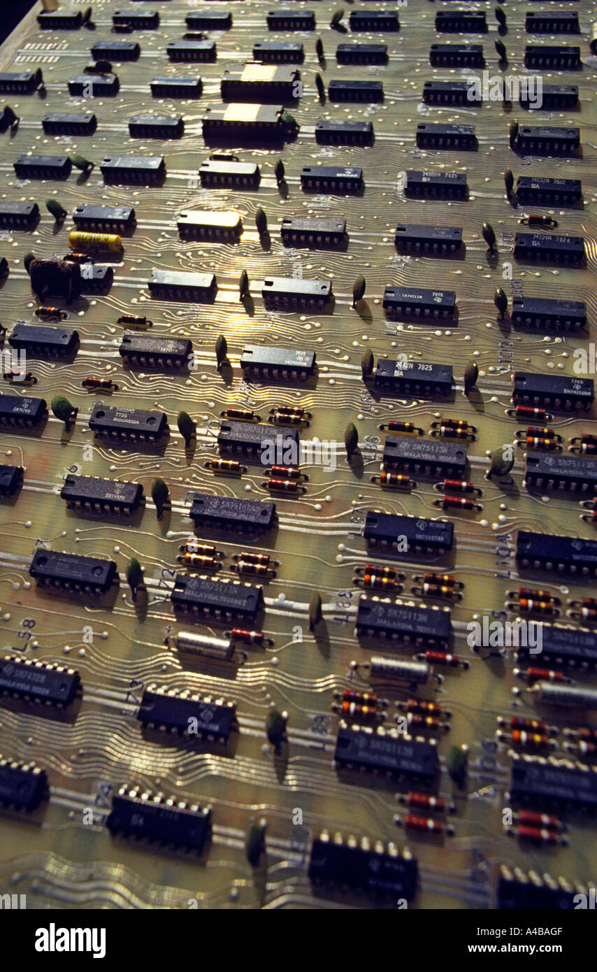 Rows of microprocessor chips catching the light on computer circuit ...