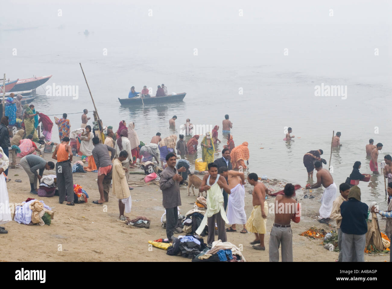 Stock image of boats and bathers along the ghats and steps of the River ...