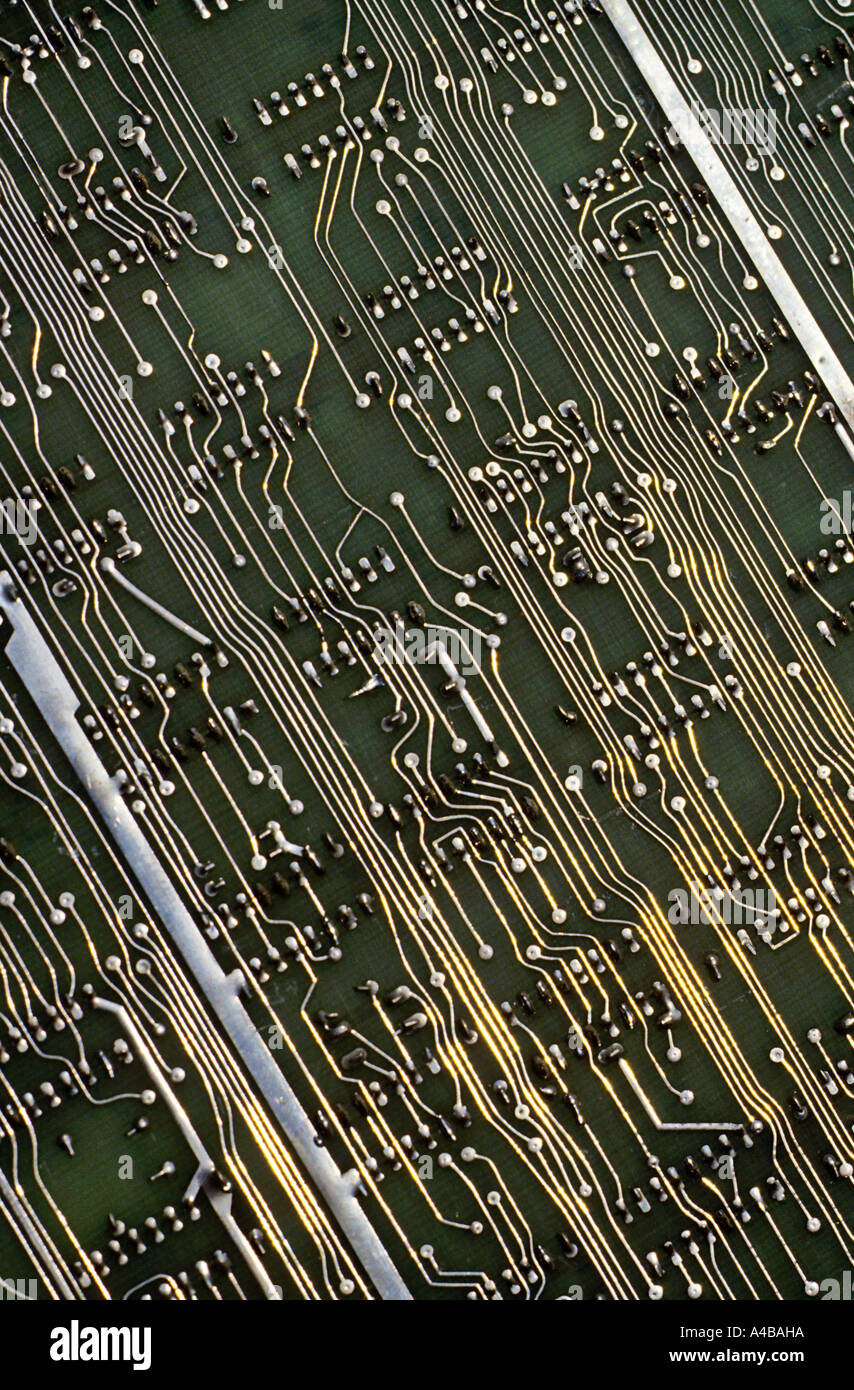 Tracks of computer printed circuit board with soldered connections ...