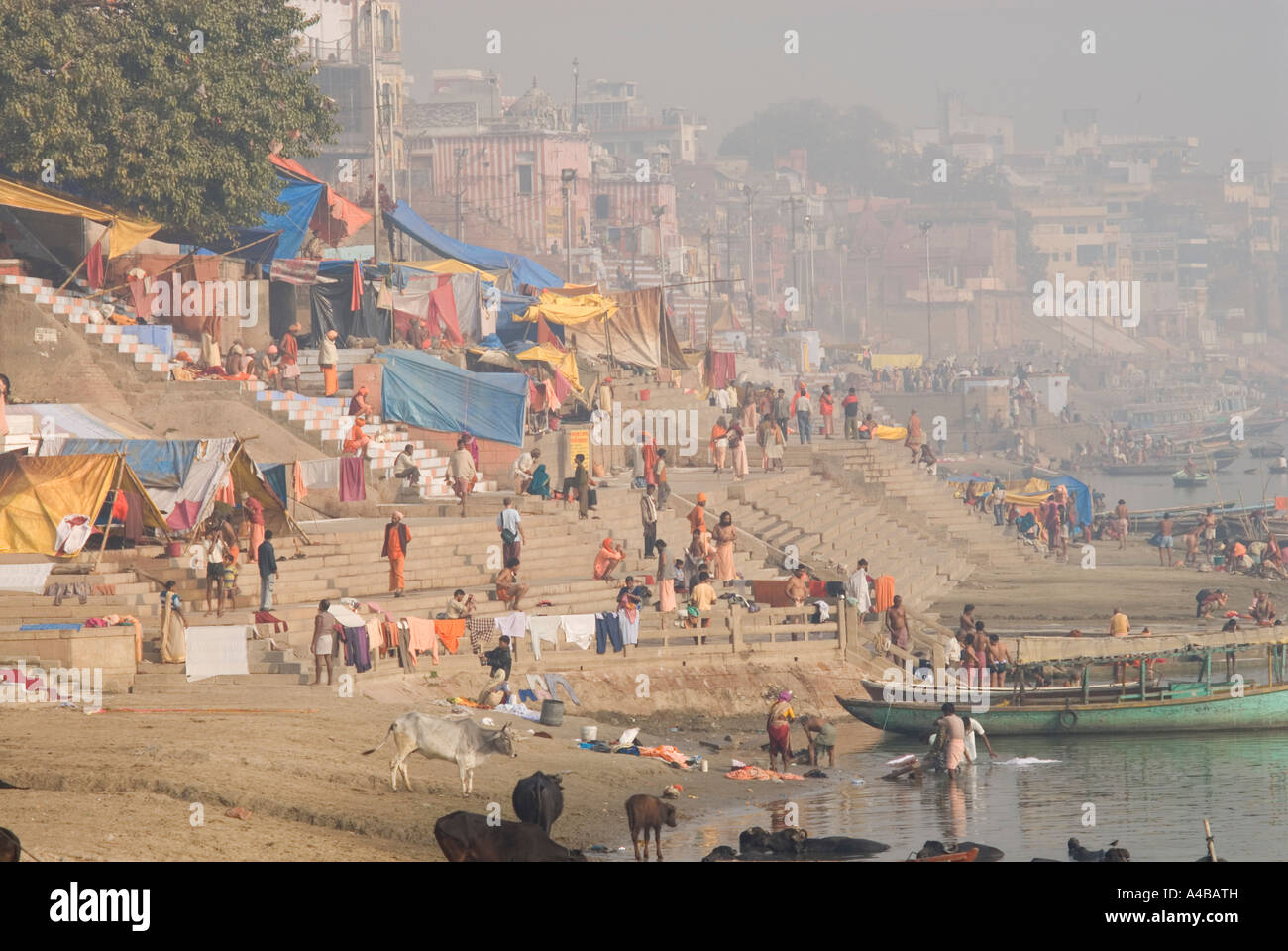 Stock image of boats and bathers along the ghats and steps of the River ...