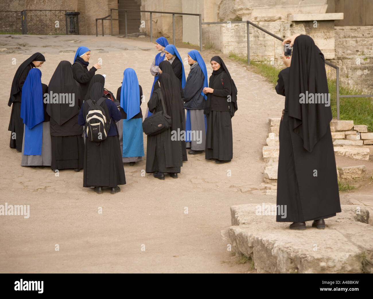 Nun taking a picture of her group outing at the Roman Forum Rome Italy ...