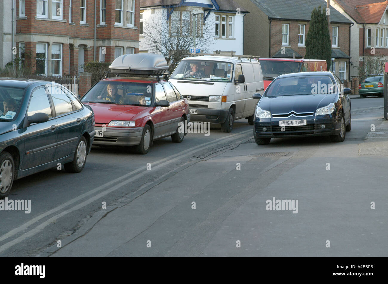 car parked on the pavement causing obstruction Stock Photo - Alamy